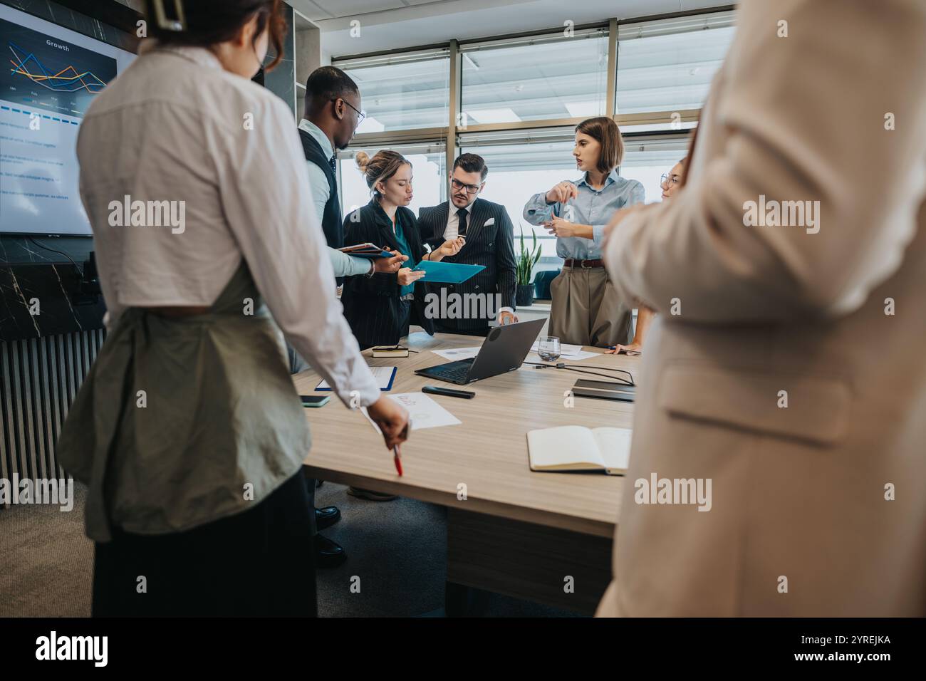 Multicultural business team collaborates in a modern office meeting ...
