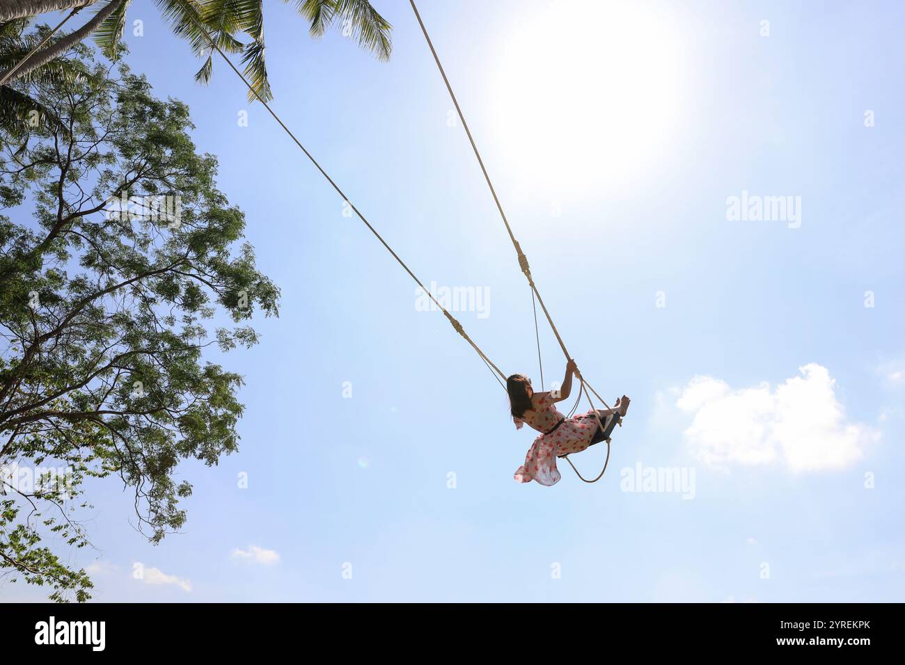 Tourist plays on swing hi-res stock photography and images - Alamy