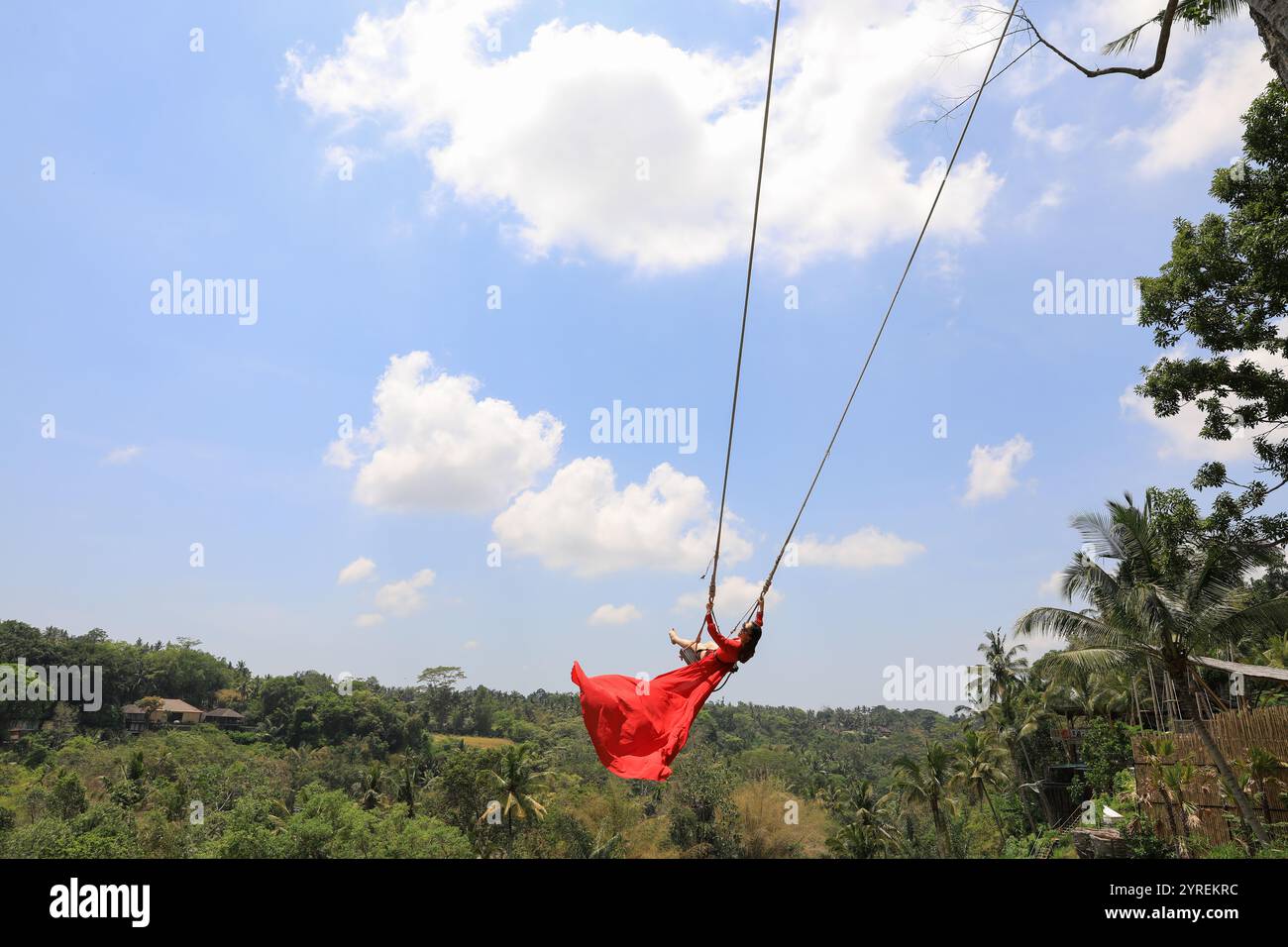 Tourist plays on swing hi-res stock photography and images - Alamy