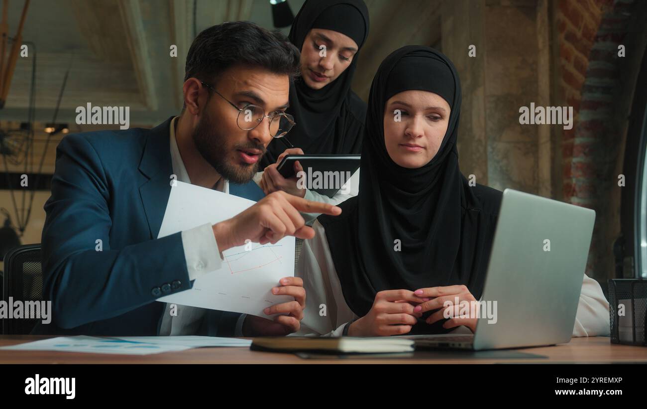 Arabian man businessman female businesswomen muslim hijab women in office talk video call laptop ...