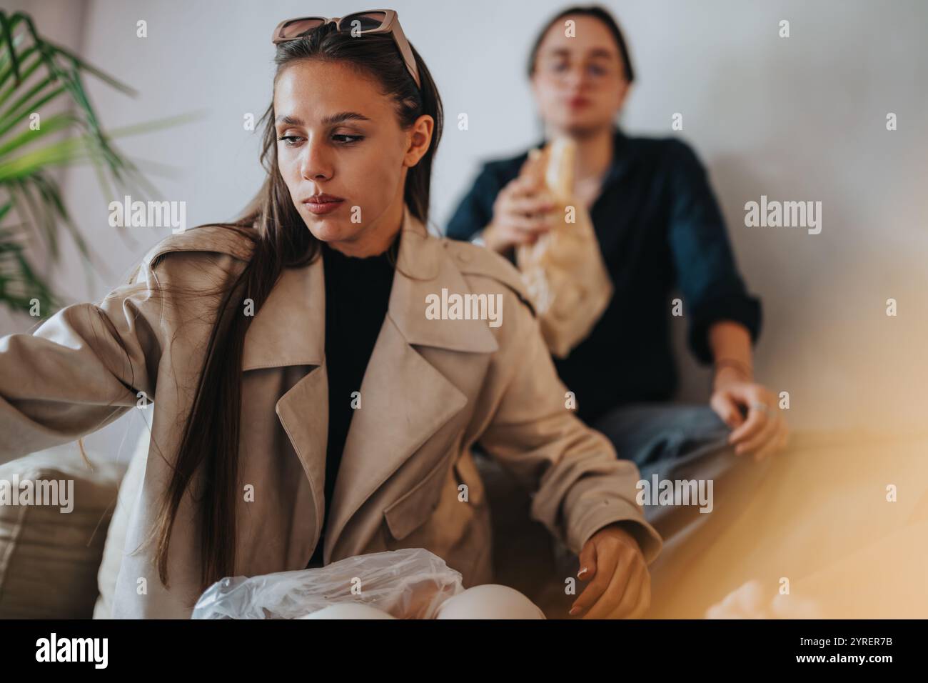 A group of students relax and enjoy breakfast together during a school ...