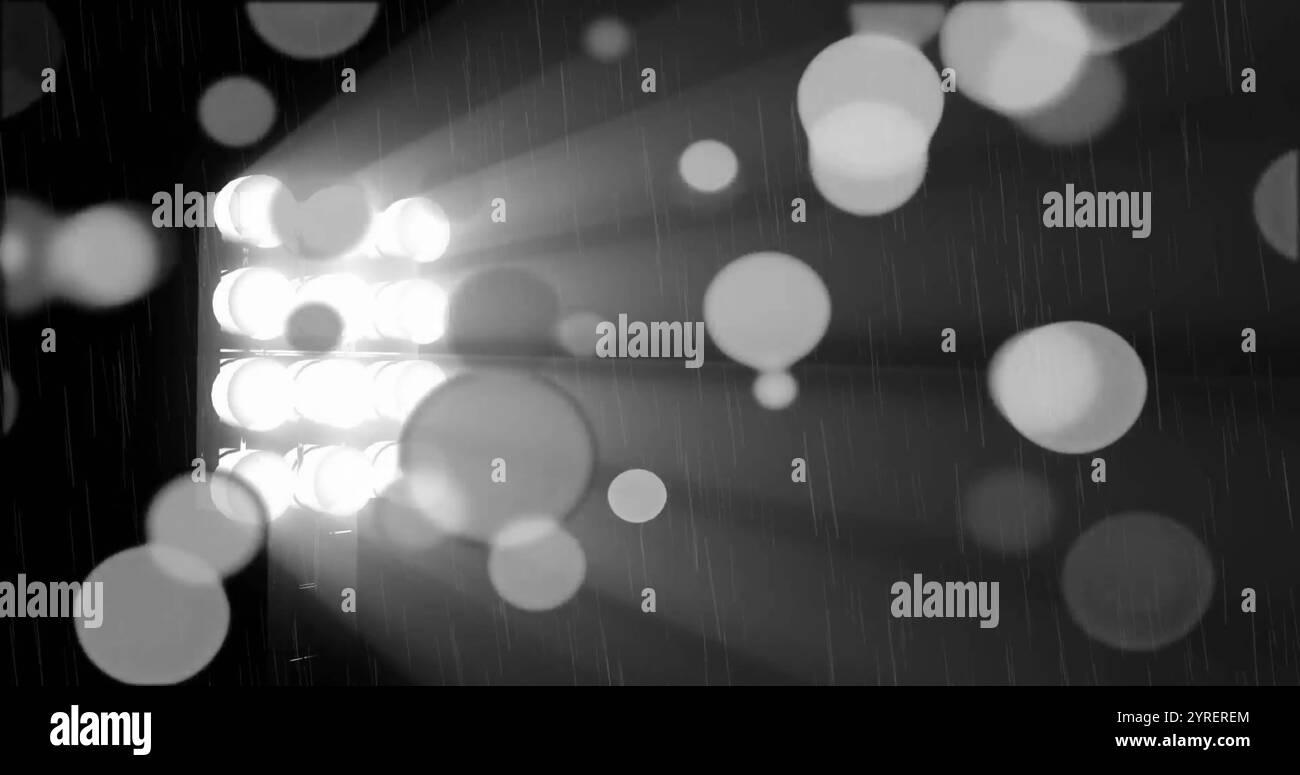 Image of glowing spots of light on dark background Stock Photo - Alamy