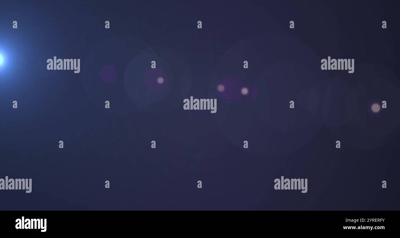 Image of glowing spots of light on dark background Stock Photo - Alamy