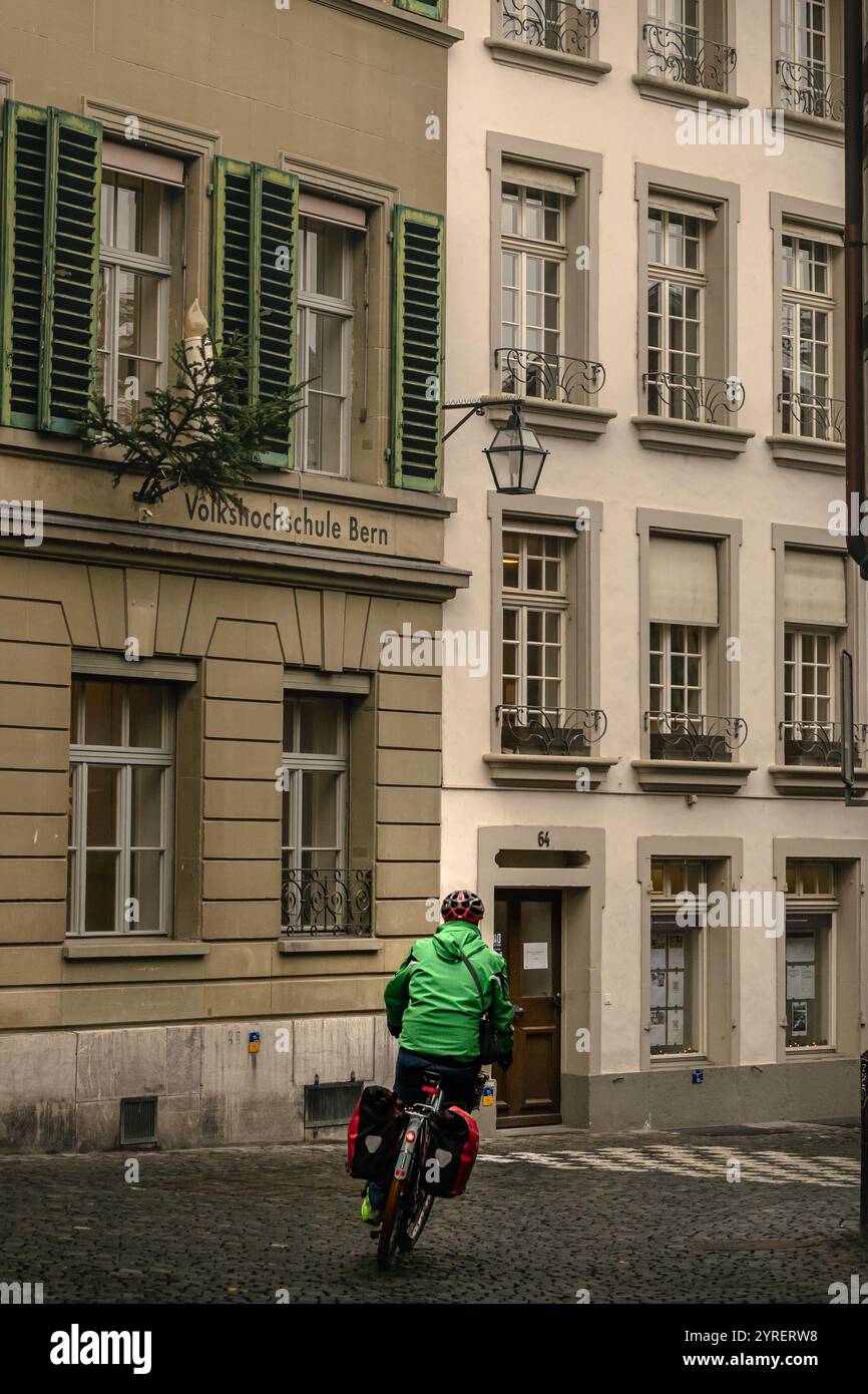 A lively Swiss street scene with people walking, surrounded by charming ...
