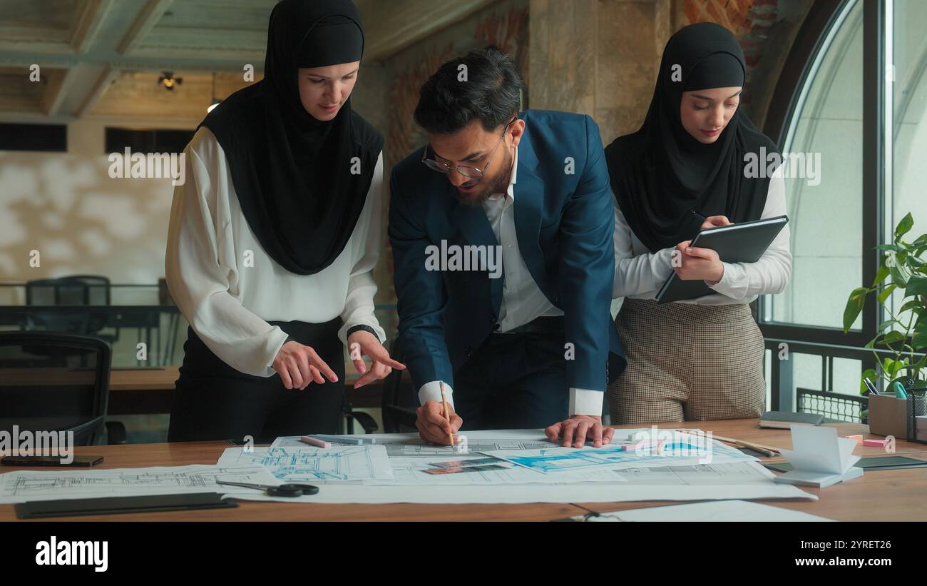 Arabian man muslim women in hijab business team colleagues architect ...