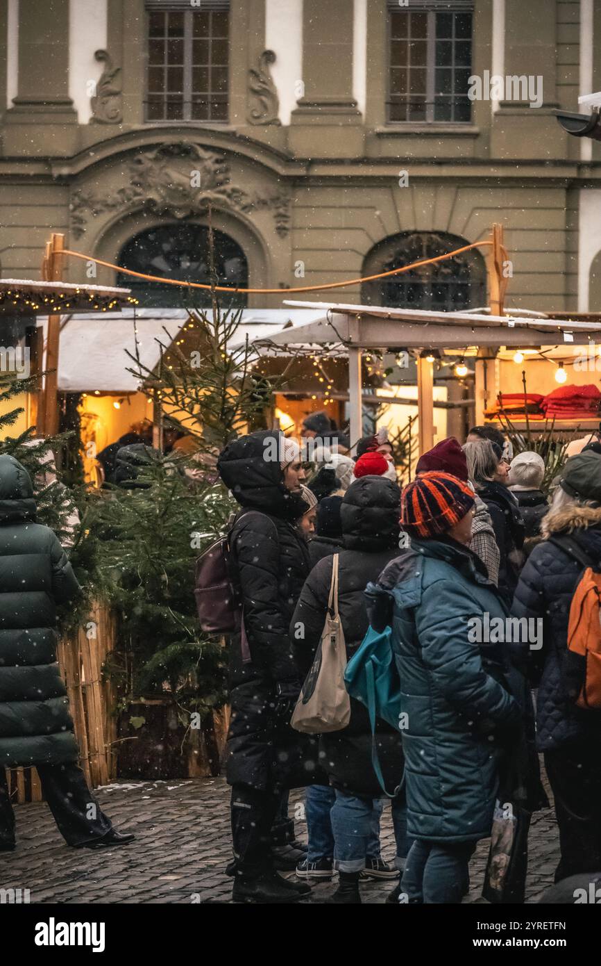 A bustling Bern Christmas market filled with festive lights, holiday ...