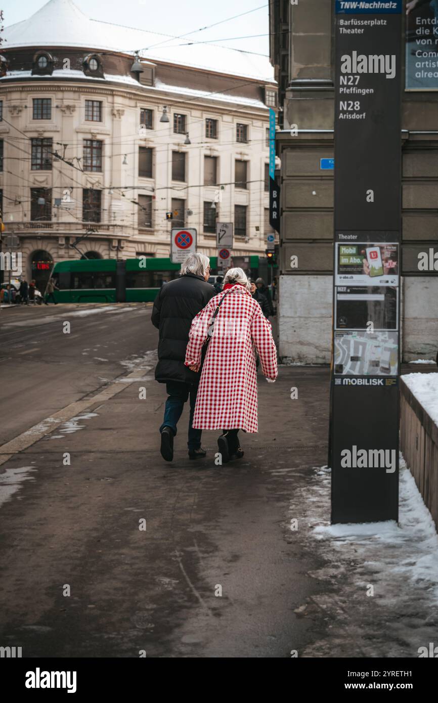 A lively Swiss street scene with people walking, surrounded by charming ...
