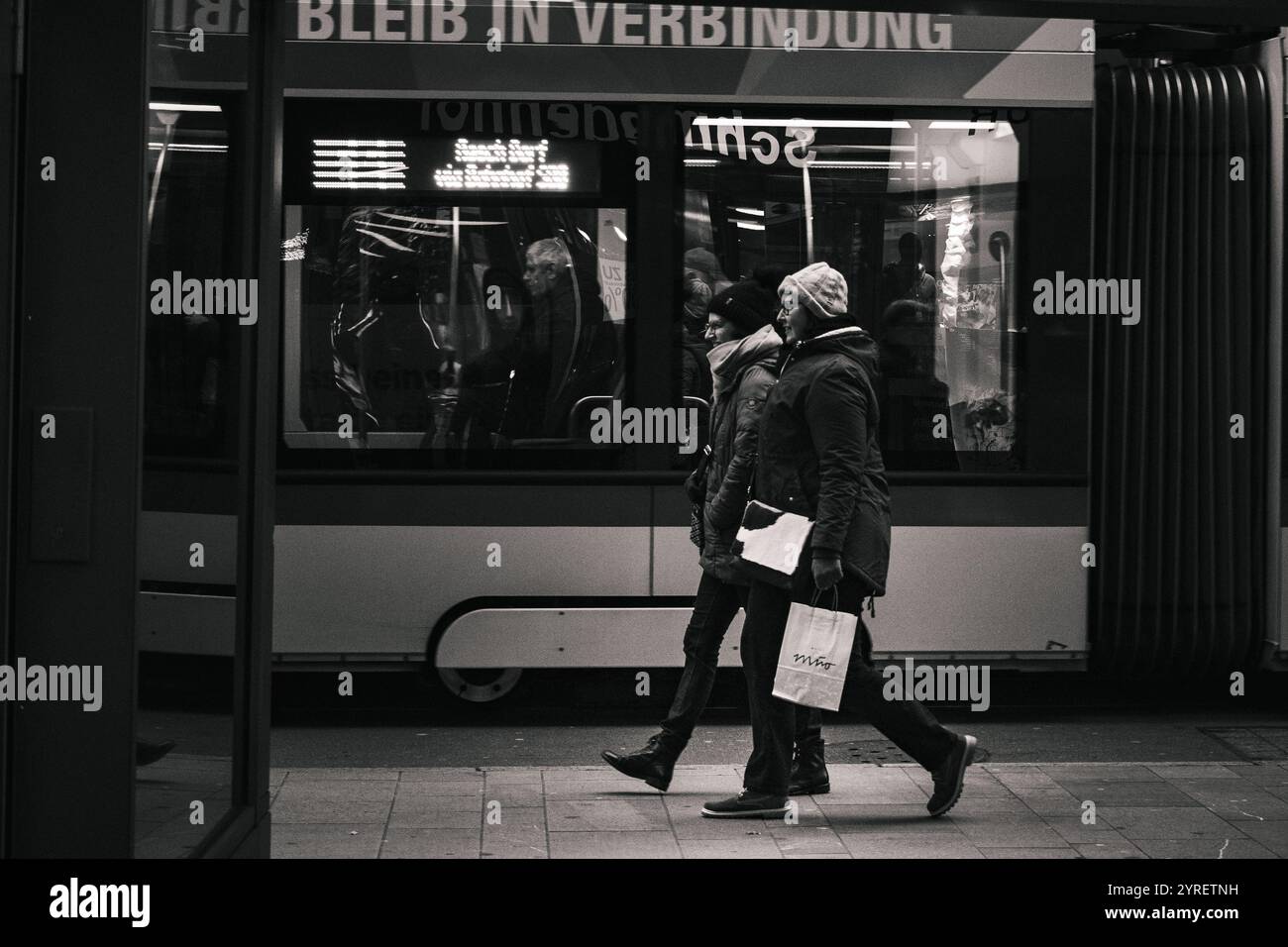 A lively Swiss street scene with people walking, surrounded by charming ...