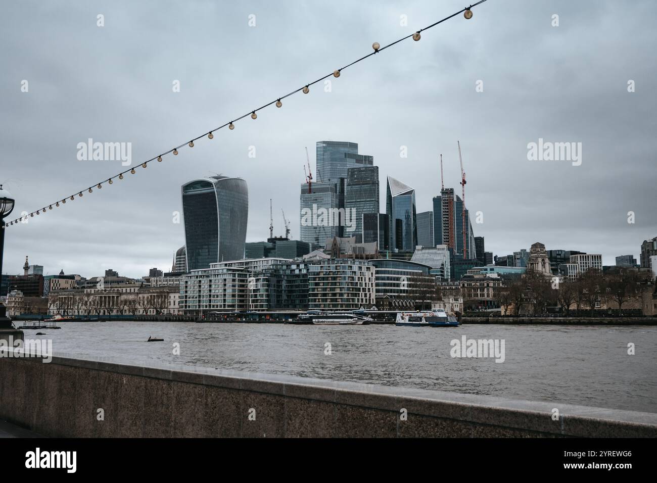 The London skyline stretches across the River Thames, showcasing iconic ...