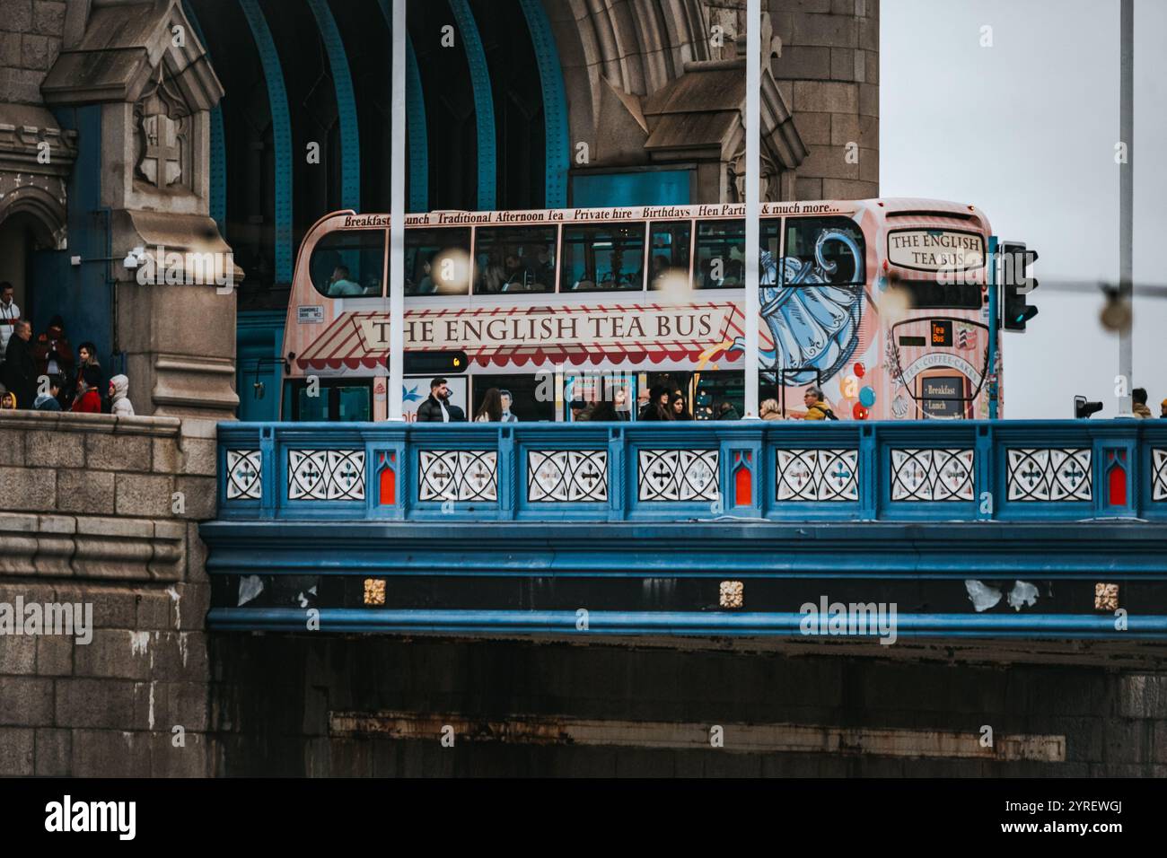 The iconic Tower Bridge in London stands tall with double-decker buses ...