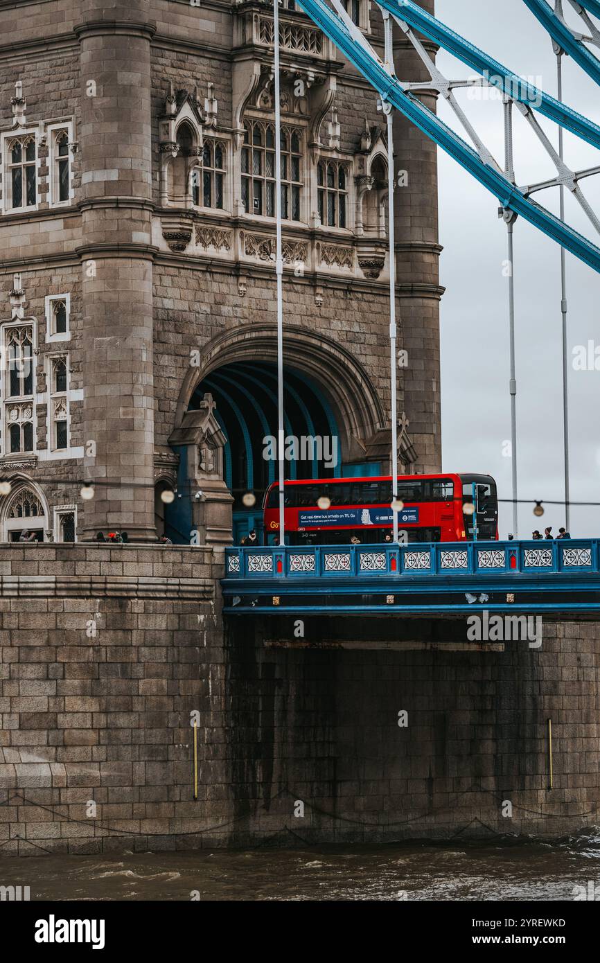 The iconic Tower Bridge in London stands tall with double-decker buses ...