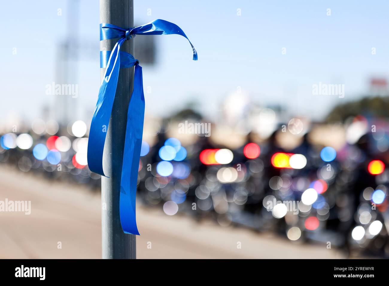 A blue ribbon in memory of Greenville police officer Cooper Dawson is ...