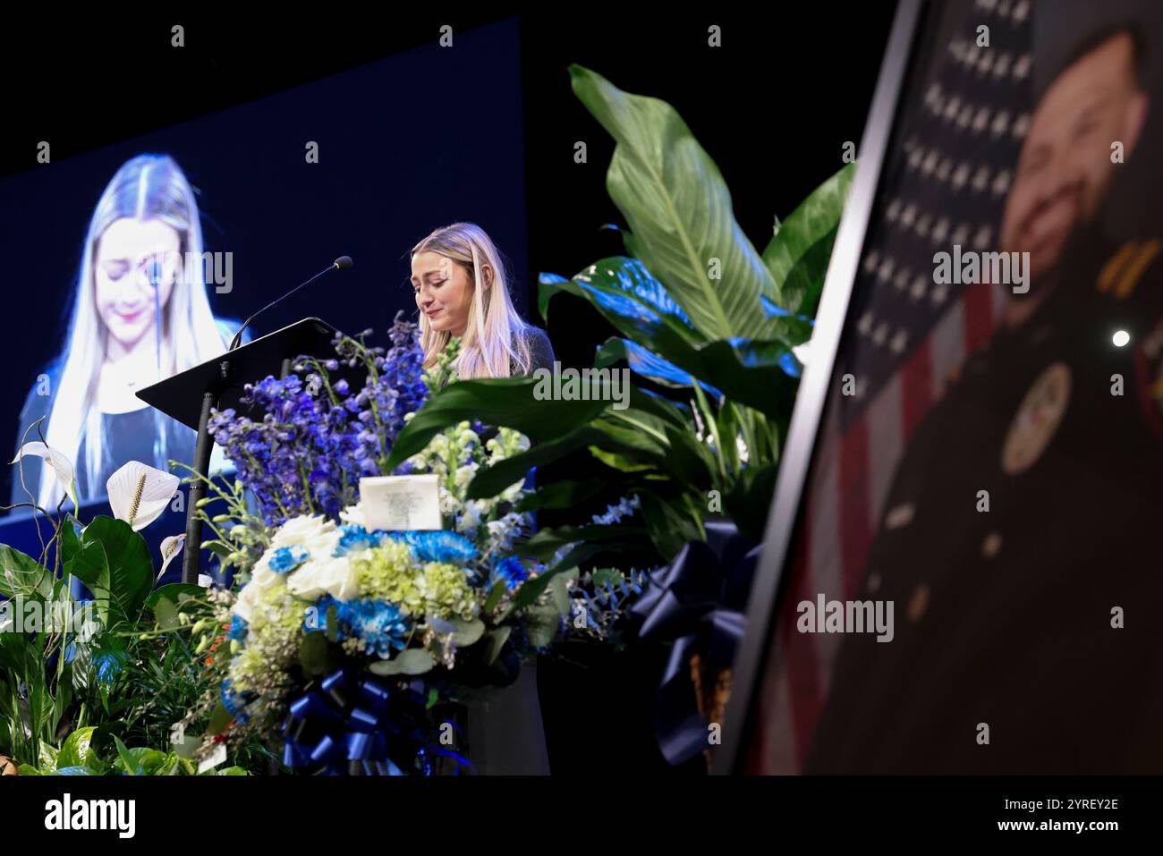 Aubrey Dawson, gets emotional as she speaks during a funeral service ...