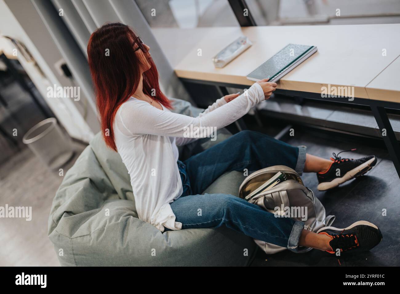 High school student studying in a comfortable modern space Stock Photo ...