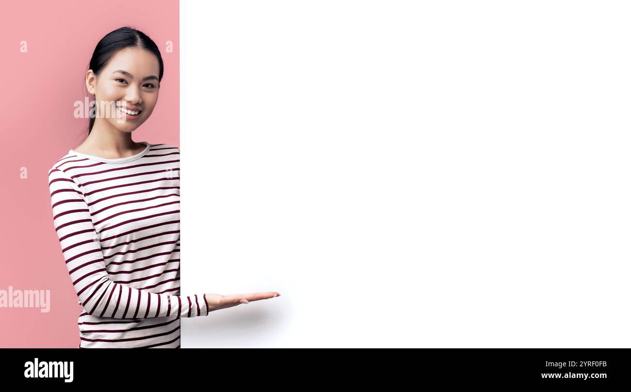 Beautiful Young Smiling Asian Lady Pointing At Blank Advertisement ...