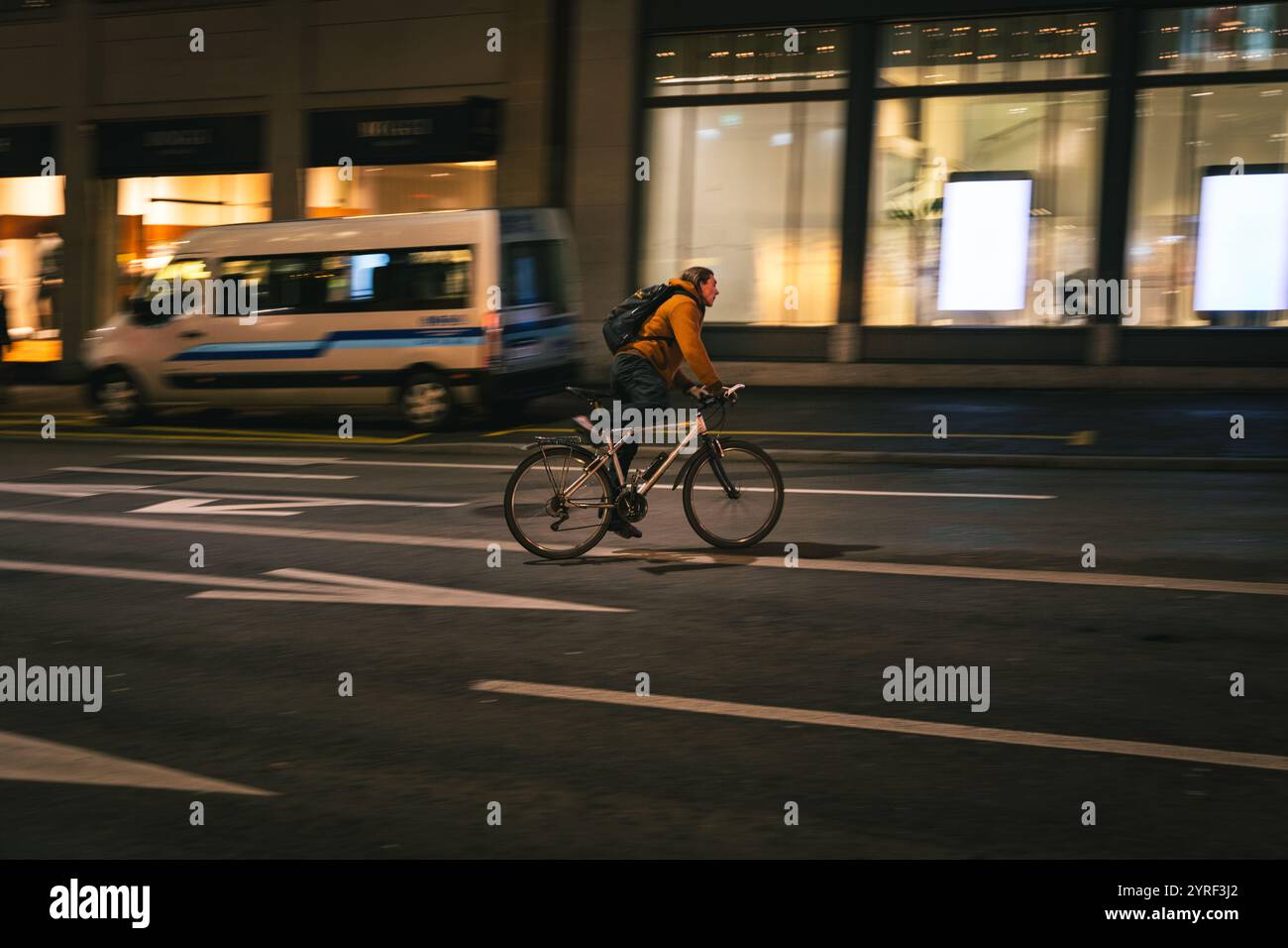 A lively Swiss street scene with people walking, surrounded by charming ...