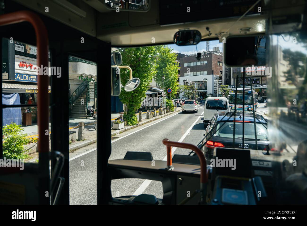 A morning view through a bus windshield in Kamakura, Japan, captures ...