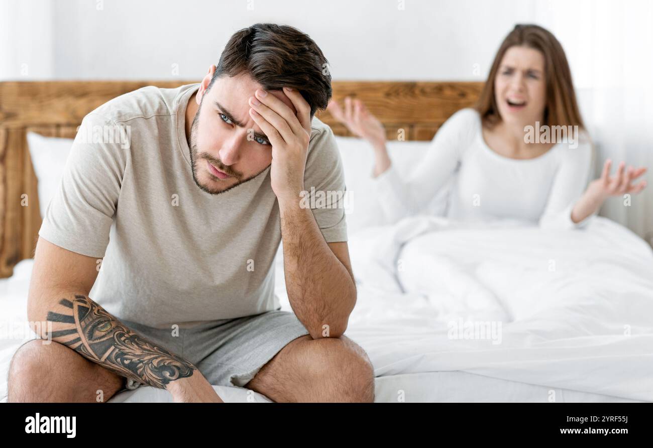 Focus on upset guy. Girl suits scandal Stock Photo - Alamy