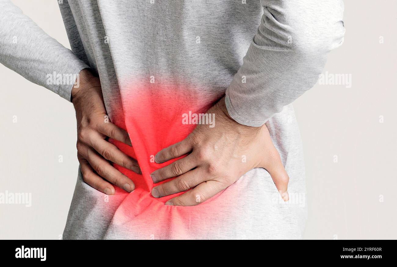 Highlighted spine pain man hi-res stock photography and images - Alamy