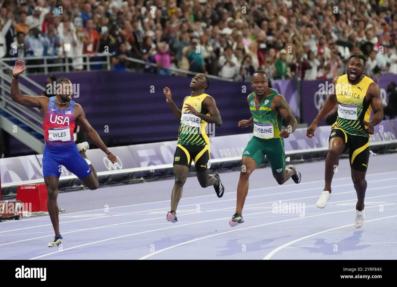 Paris, France. 04th Aug, 2024. Noah Lyles of the U.S. (L) crosses the finish line to win the ...