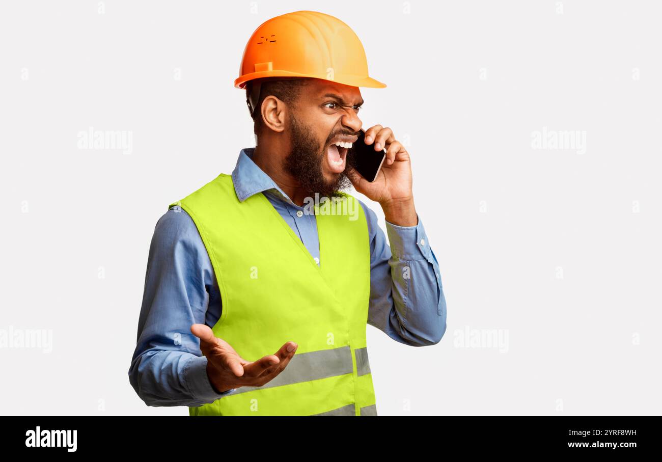 Angry Builder Yelling In Cellphone Standing In Studio, Panorama Stock ...