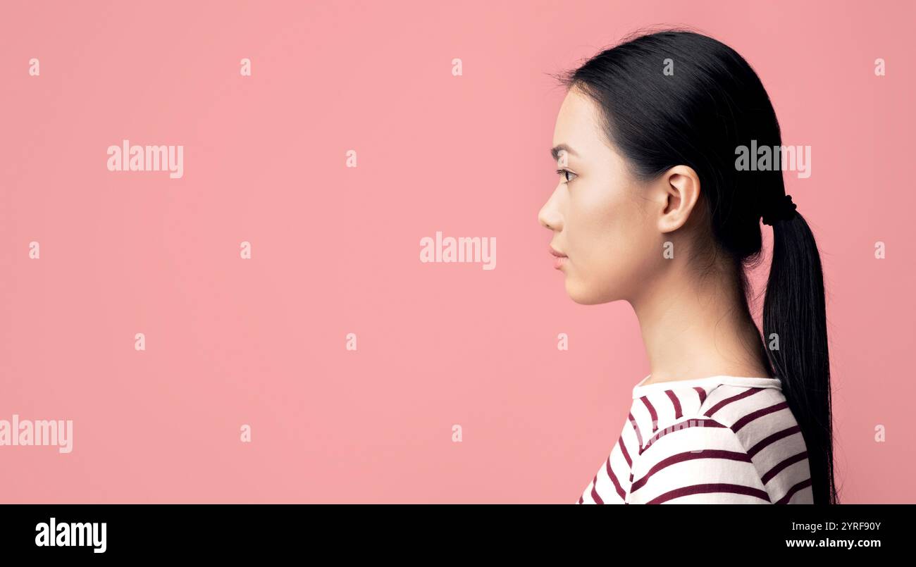 Asian woman profile looking thinking serious hi-res stock photography ...