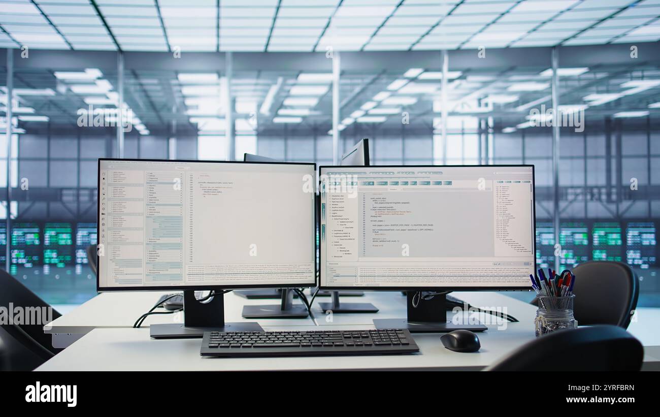 Lines of code running on computer screens in data center, used for ...