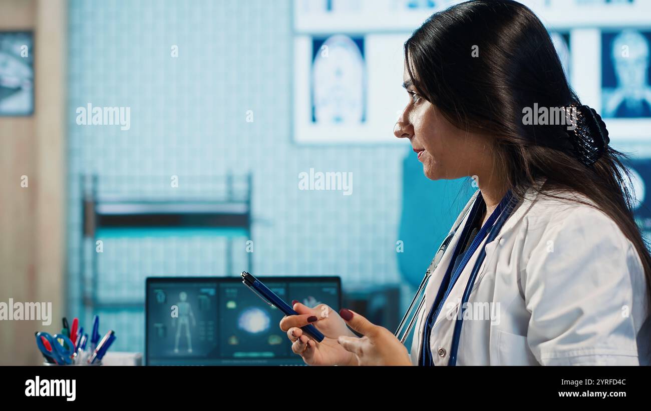 Indian medical staff and male patient engaging in a check up exam with ...