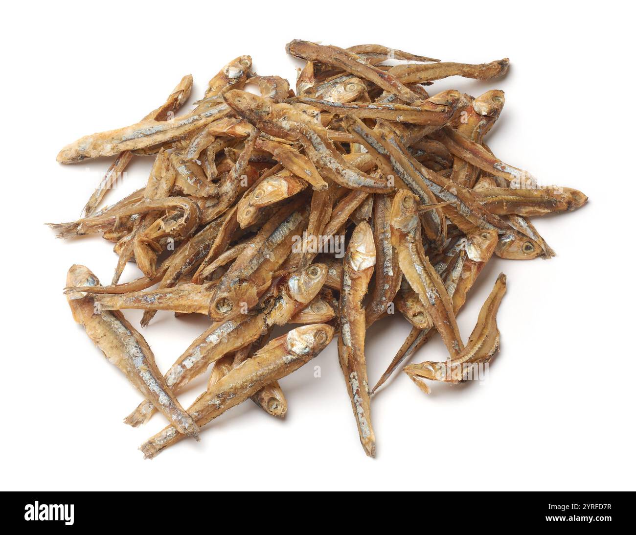 pile of dried sprats or anchovies isolated white background, preserved ...