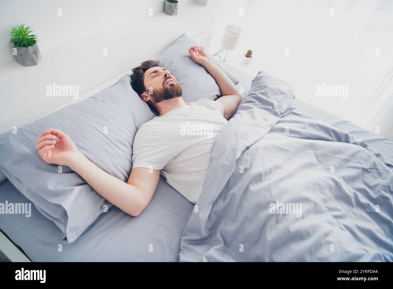 Photo of funny mature guy dressed sleepwear lying bed sleeping deeply ...