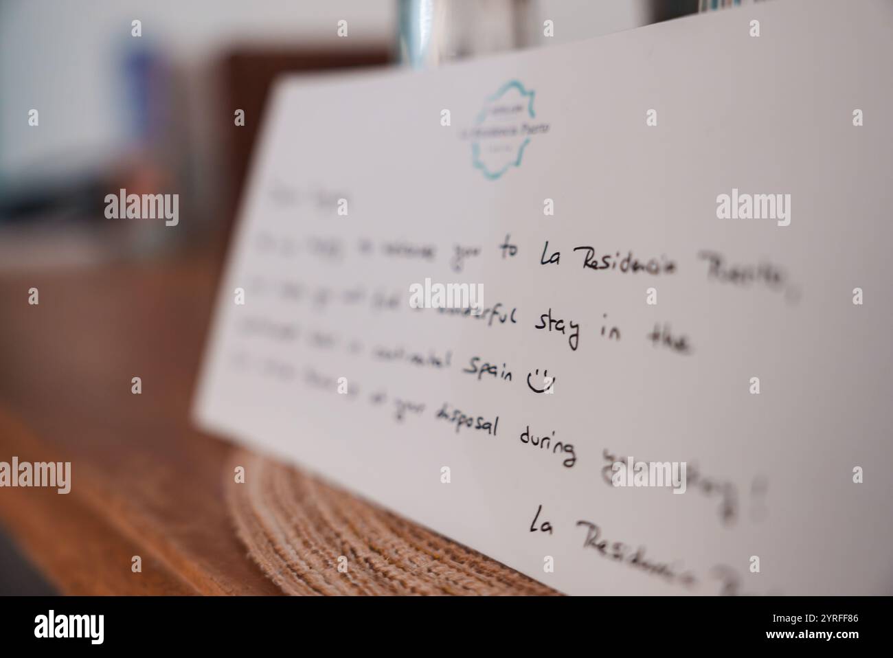 Handwritten Welcome Note on Wooden Surface in Spanish Hotel Room Stock ...