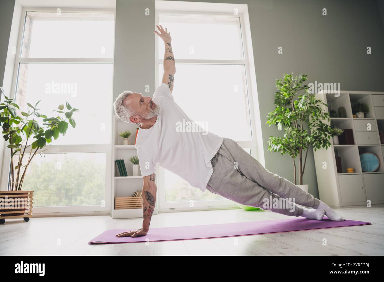Man performing side plank hi-res stock photography and images - Alamy