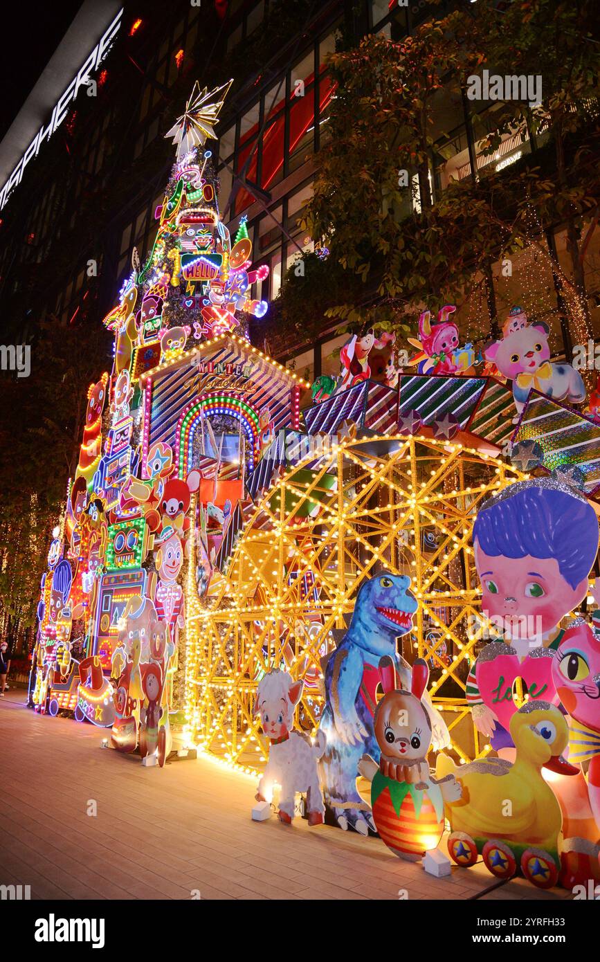 Beautiful cartoon characters and light bulbs decorations at Christmas tree in Celebration 2025 ...