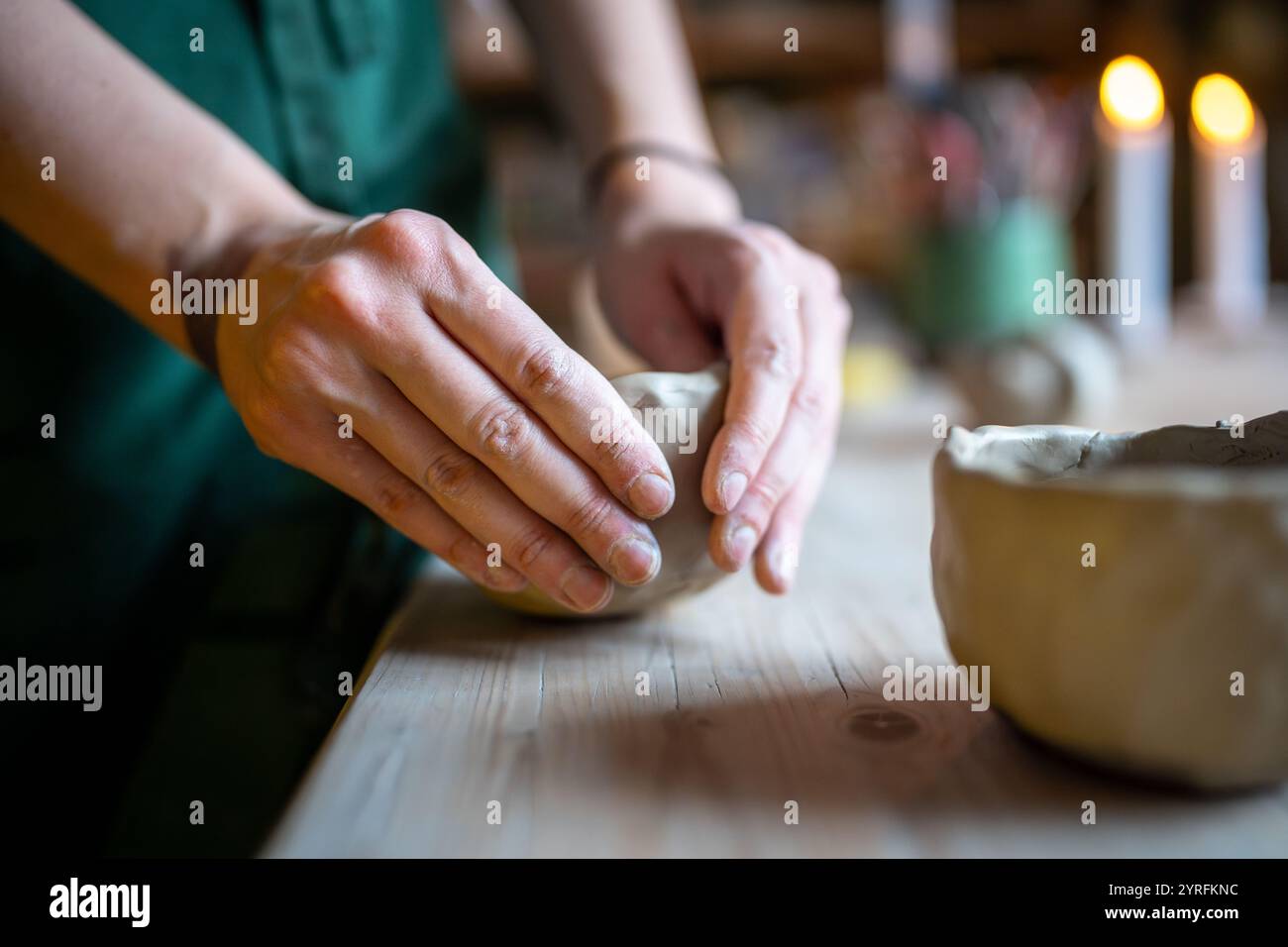 Work with your hands, artist female molding raw clay for sculpturing ...