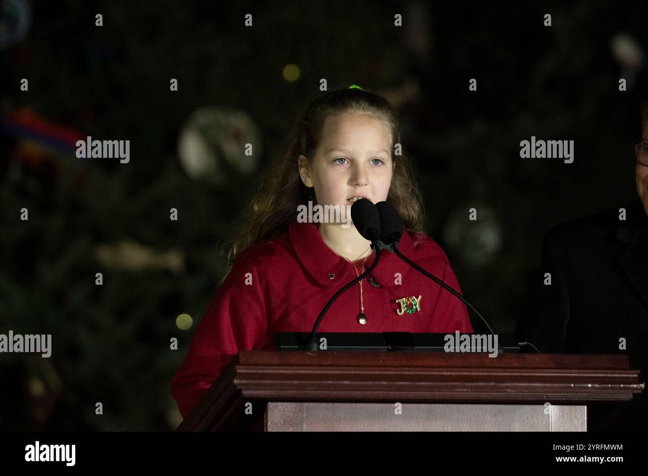 4th grade student Rose Burke reads an essay about the meaning of ...