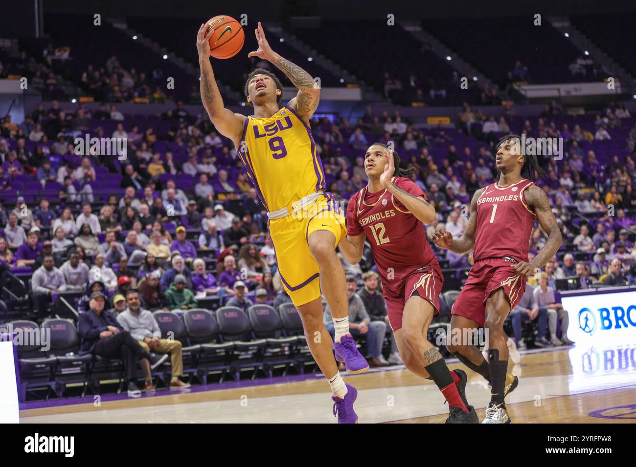 December 03, 2024: LSU's Jalen Reed (9) tries to drive to the basket ...