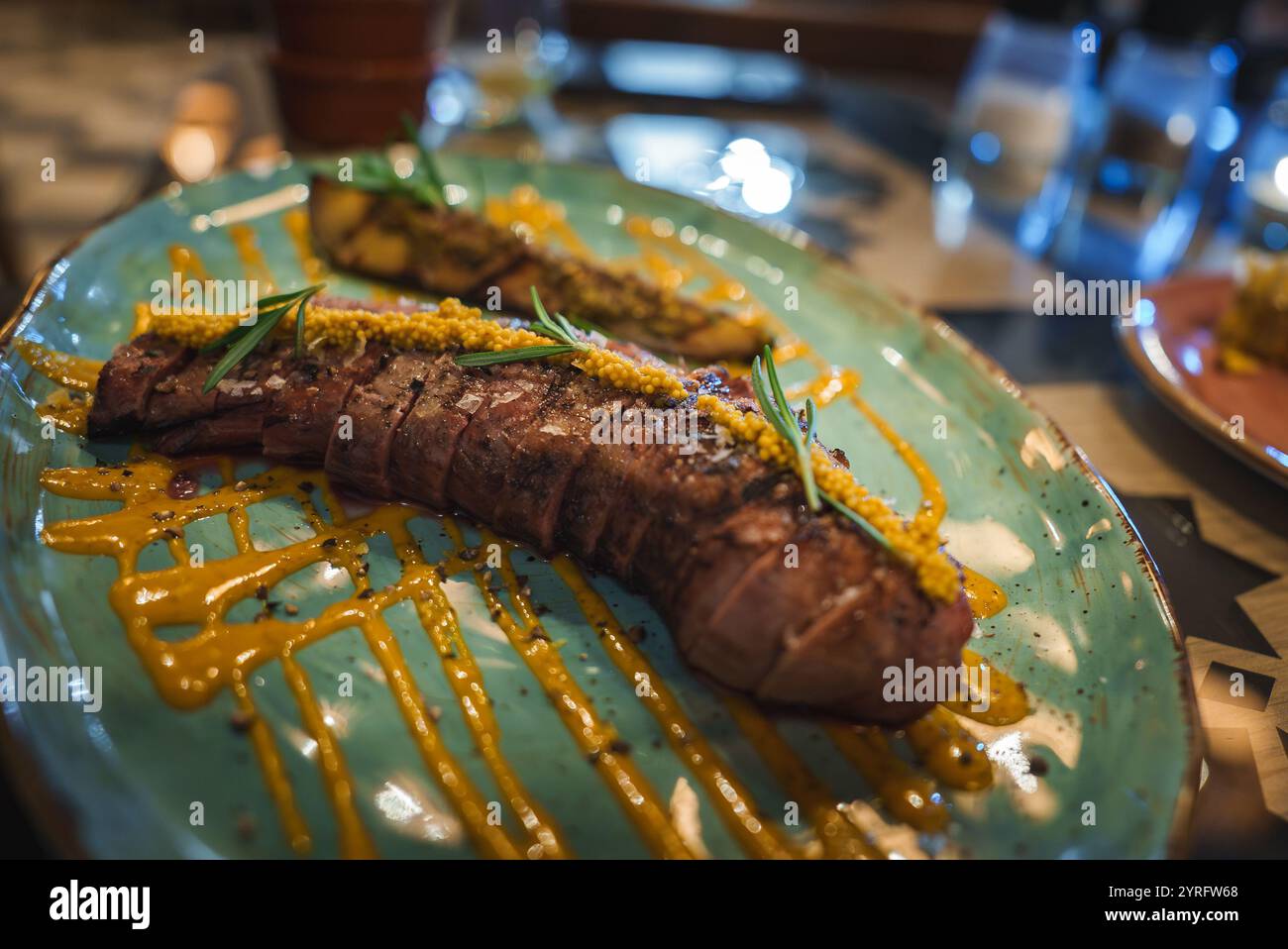Gourmet Meat Dish on Turquoise Plate in Tarifa Restaurant Setting Stock ...