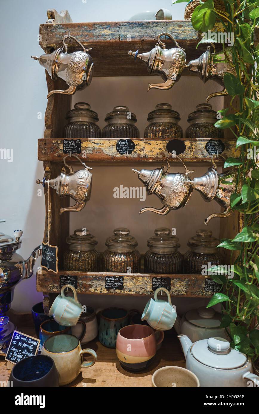 Rustic Wooden Shelf with Silver Teapots and Colorful Ceramics Stock ...