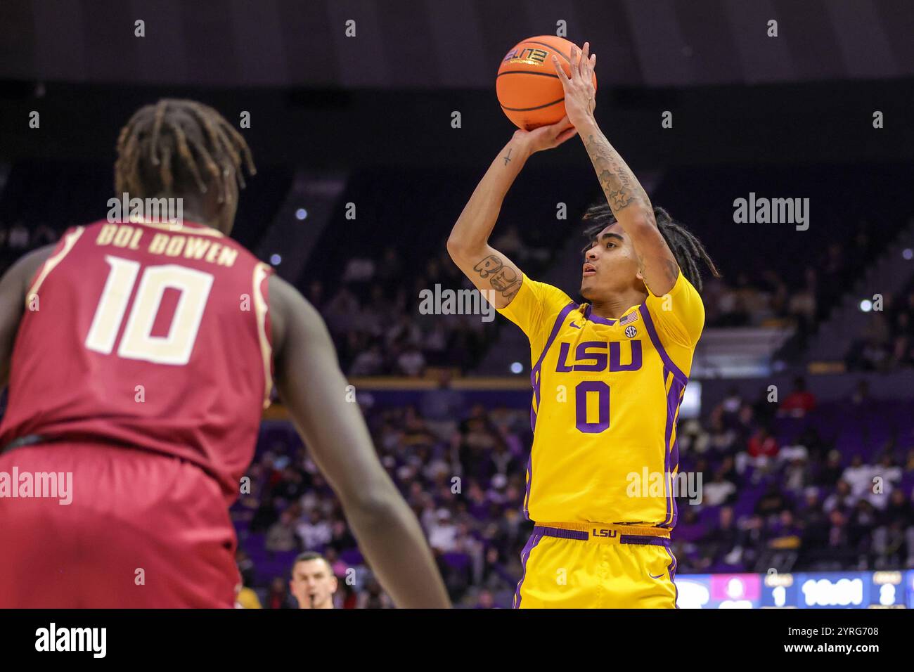 December 03, 2024: LSU's Vyctorius Miller (0) puts up a three point ...