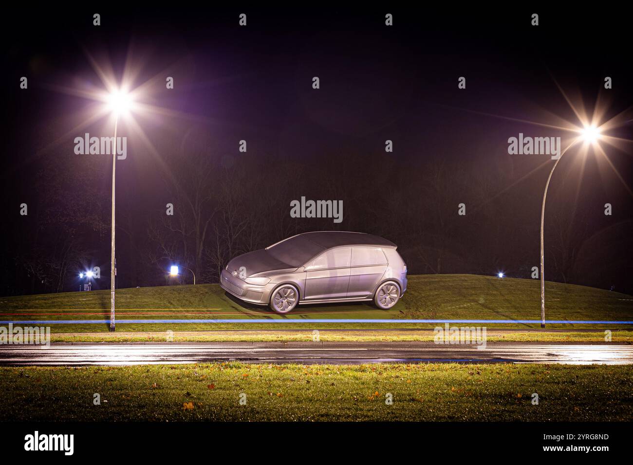 Wolfsburg, Germany. 04th Dec, 2024. Vehicles drive along in front of an ...