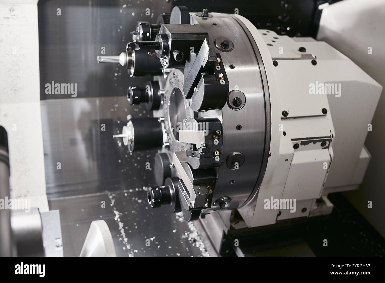 CNC turn mill machine chamfer cutting the metal shaft parts. The hi ...