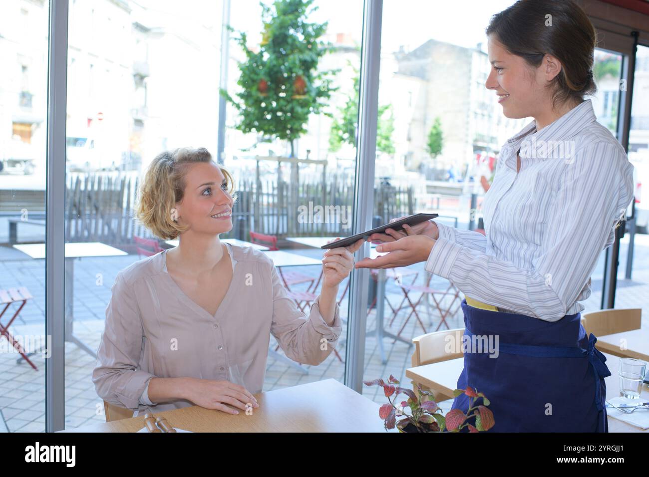 Woman ordering food hi-res stock photography and images - Alamy