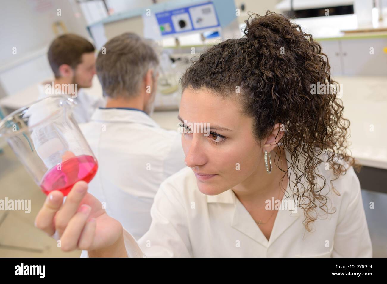 red liquid reagent in a flask Stock Photo - Alamy