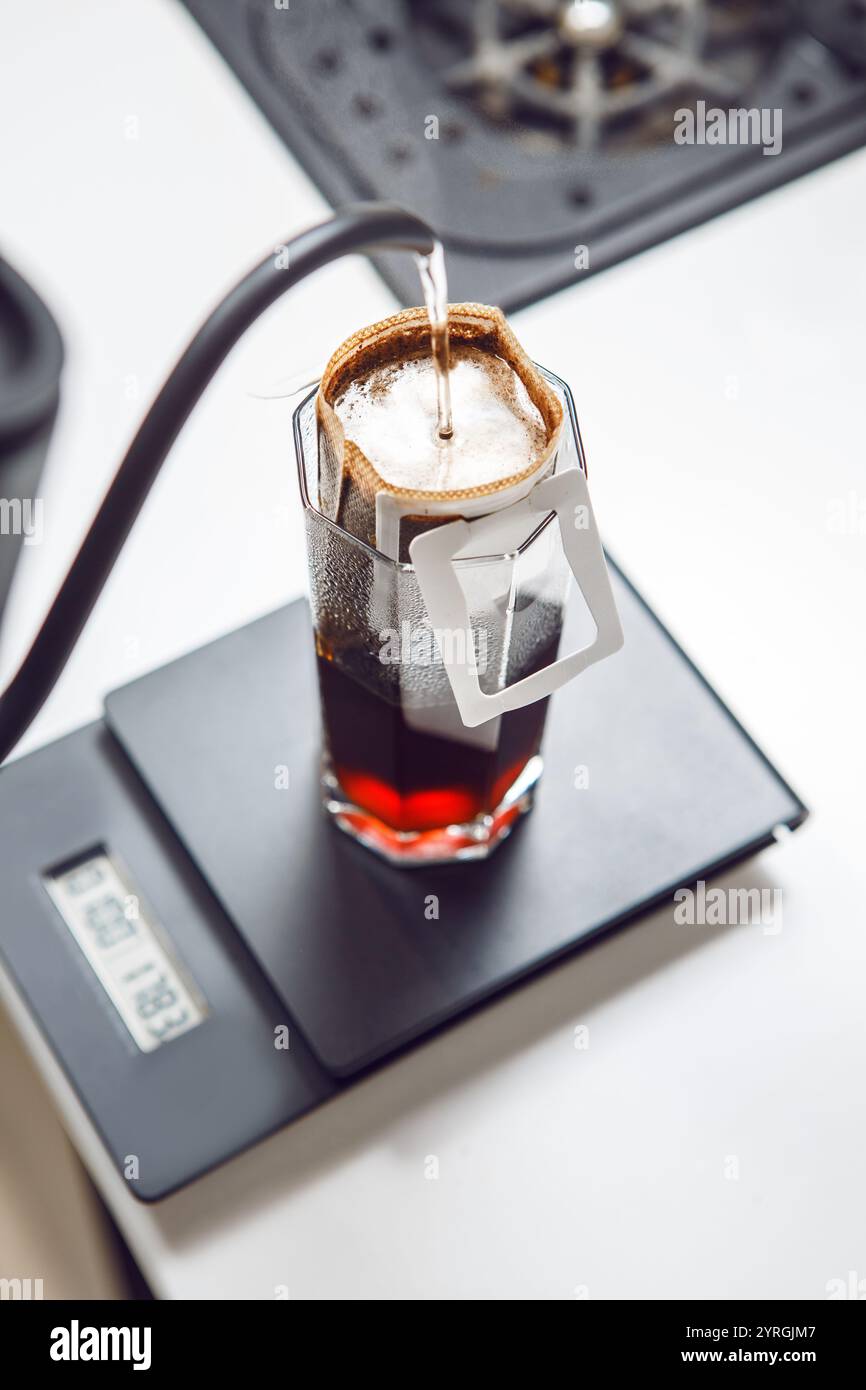 Hot Water is Poured Over a Coffee Drip Bag Resting on Scale for Precise ...