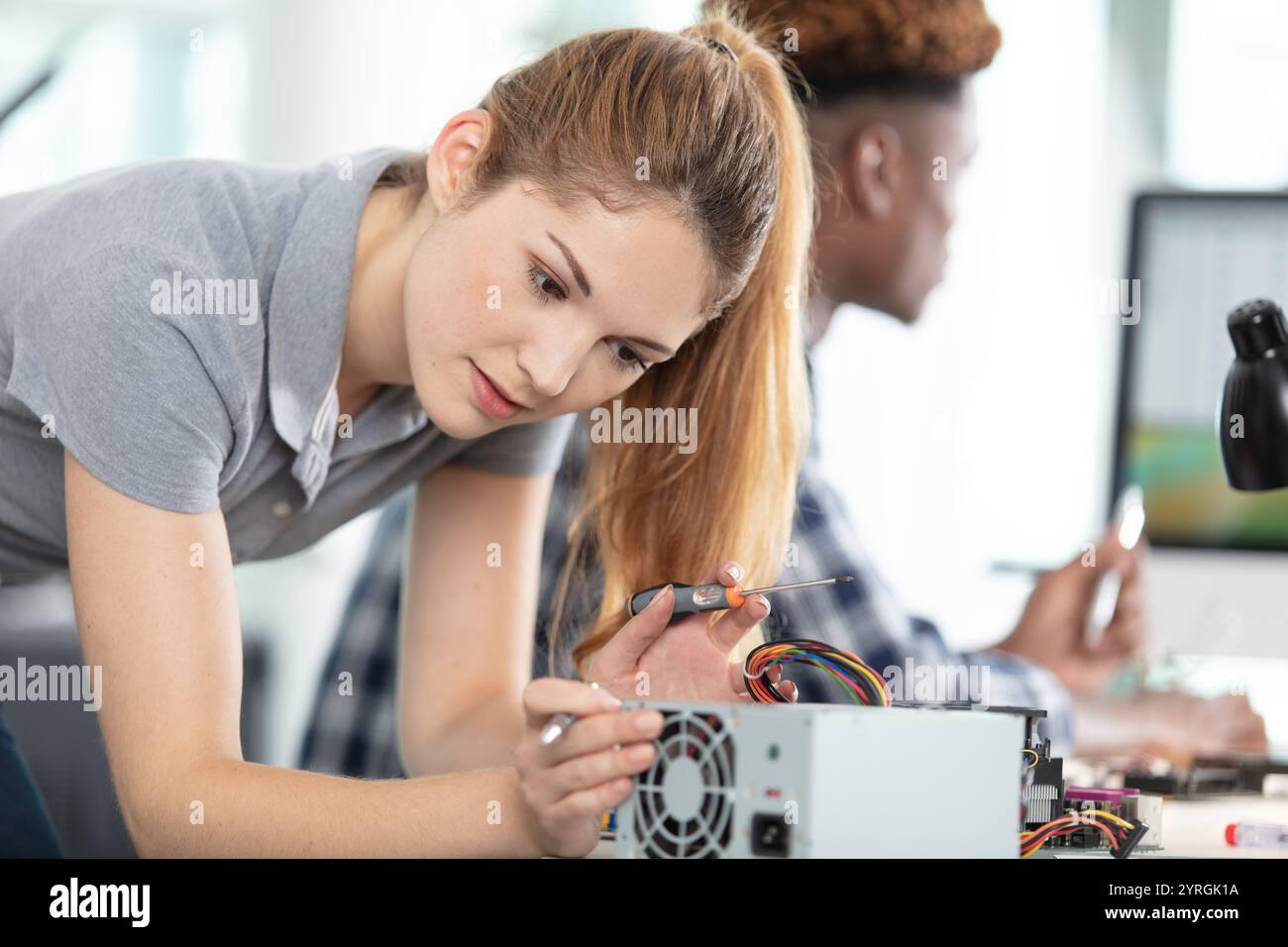 Woman fixing motherboard hi-res stock photography and images - Alamy