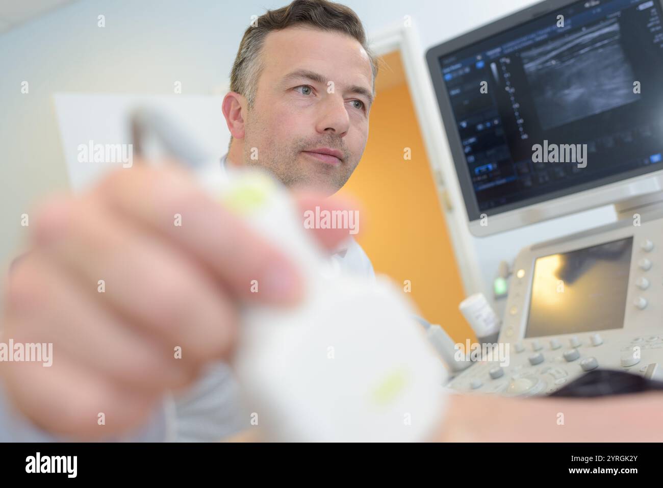 doctor examining elderly patients hernia on the echograph Stock Photo ...