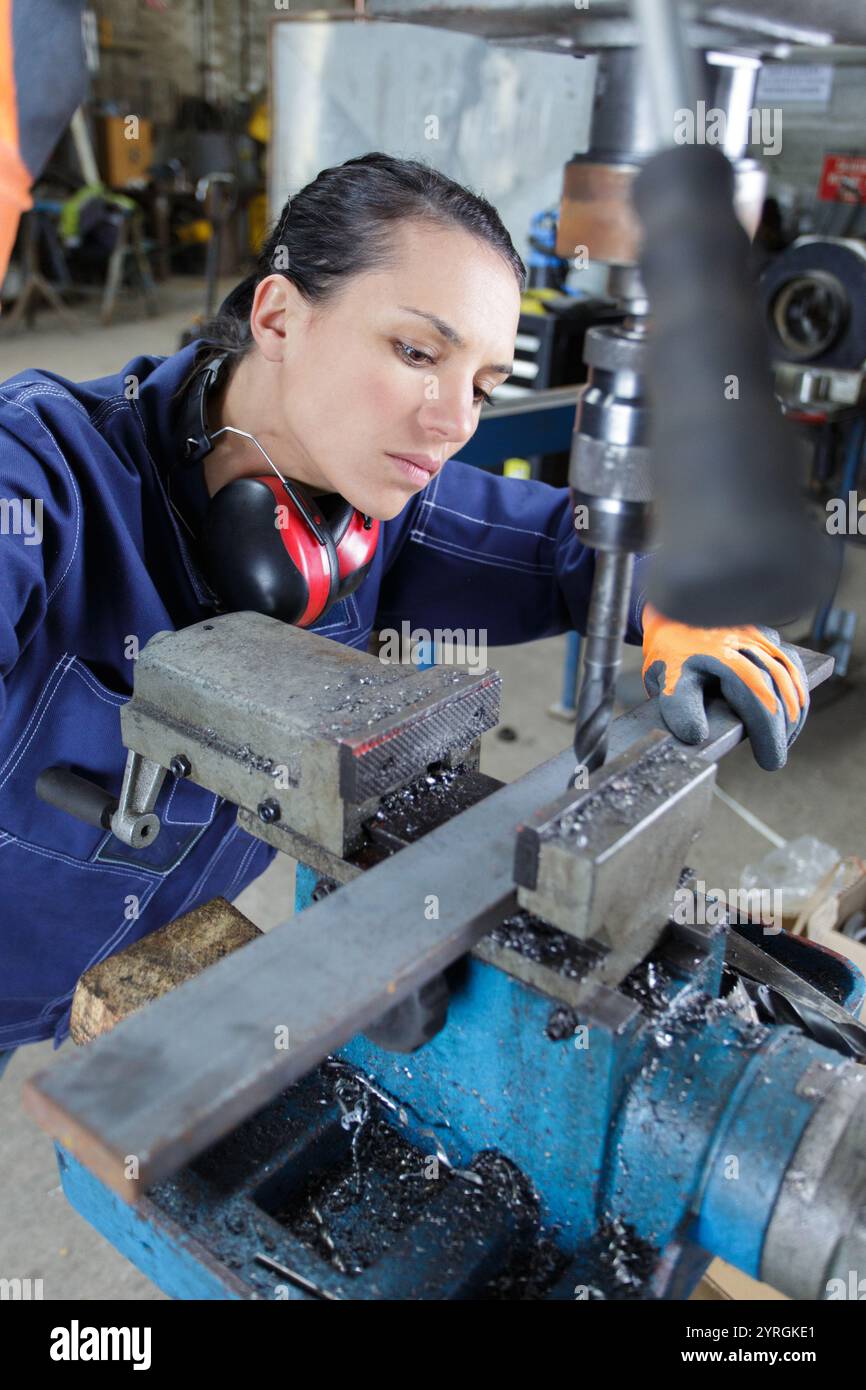 woman mechanical engineer working in factory Stock Photo - Alamy