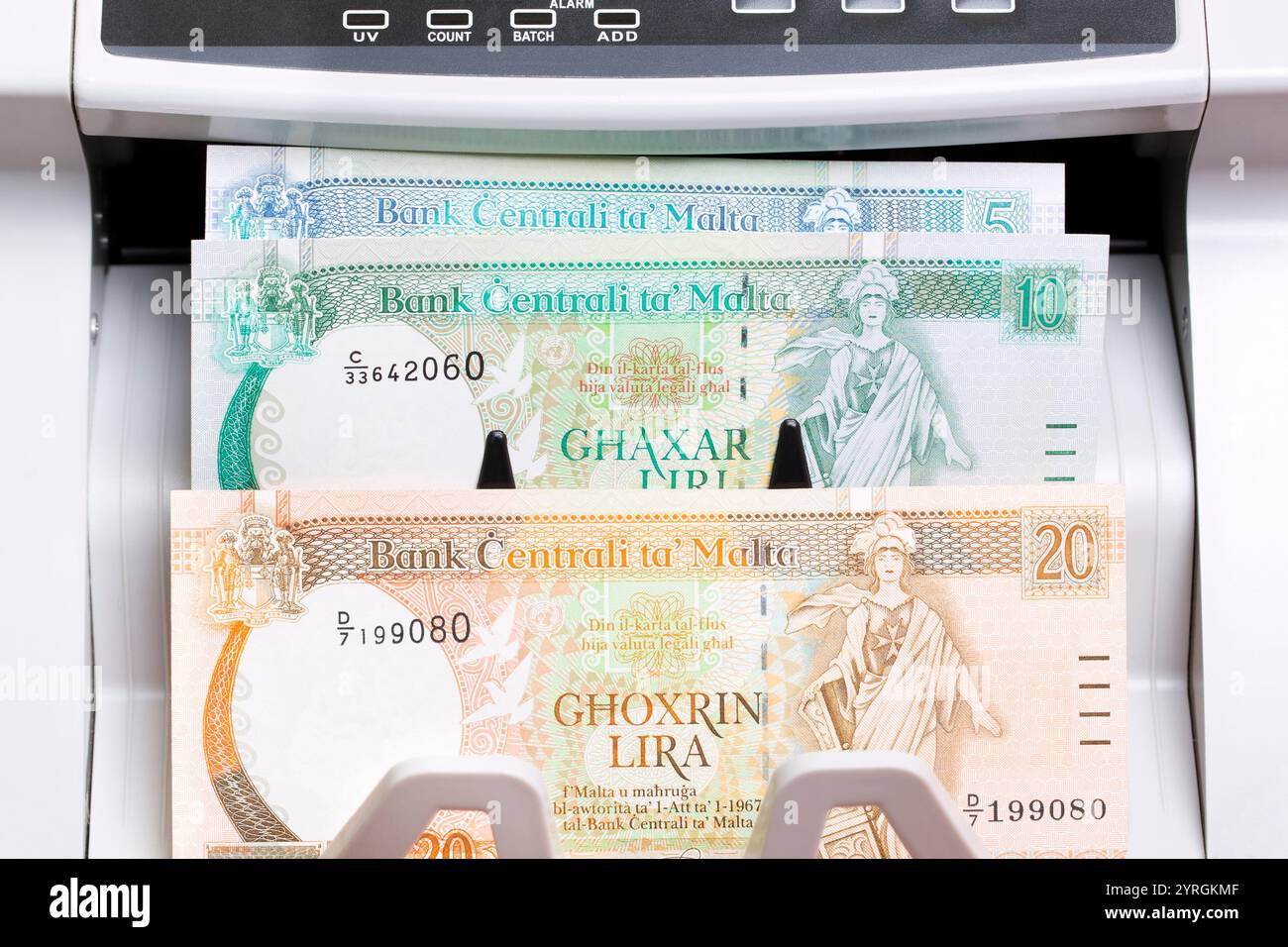 Maltese money - lira in the counting machine Stock Photo - Alamy