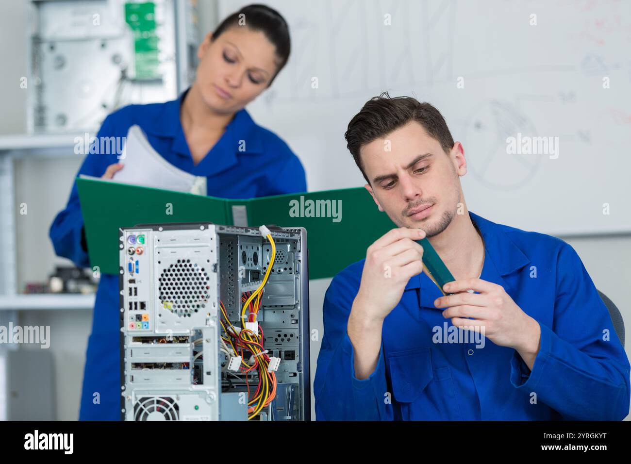 team of students examining and repairing computer parts Stock Photo - Alamy