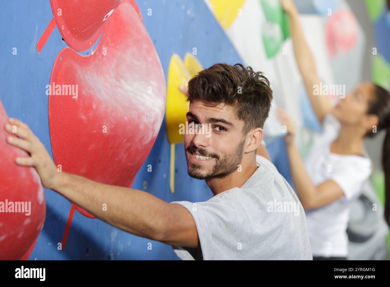 a male wall climber smiling Stock Photo - Alamy